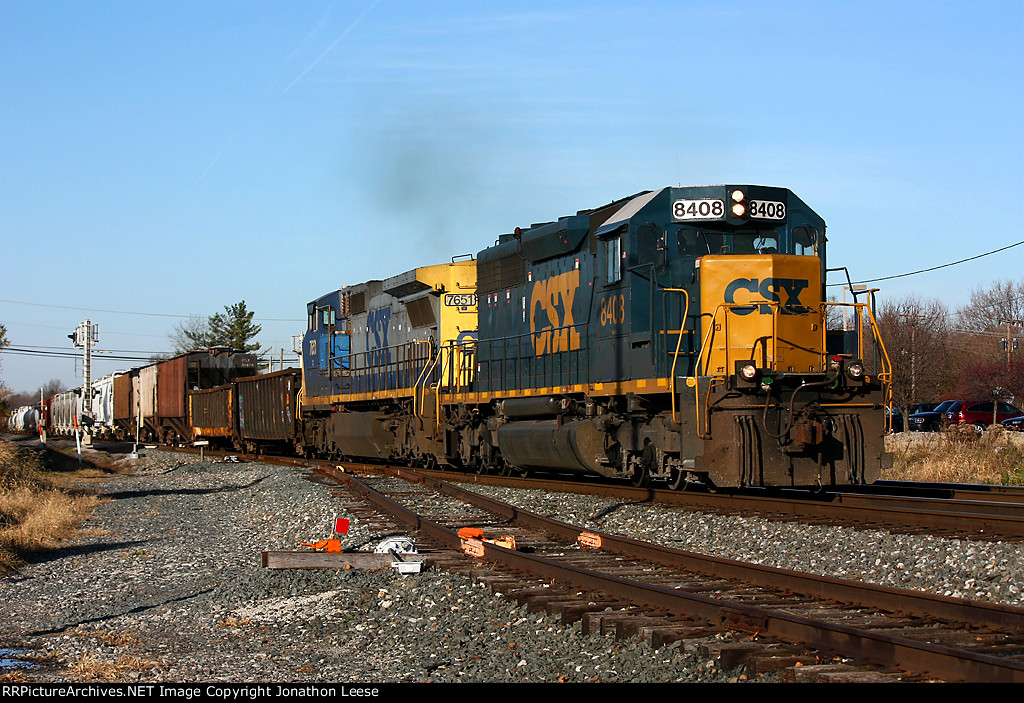 CSX 9408 leads Q324 through town